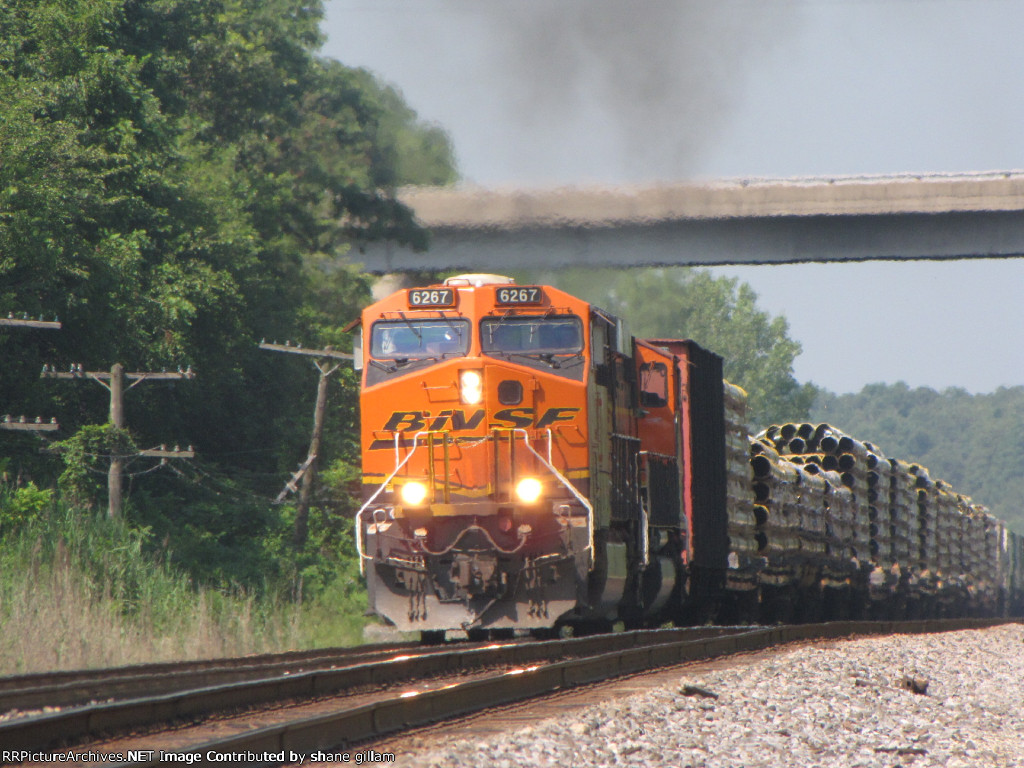 BNSF 6267 heads east with a freight train.